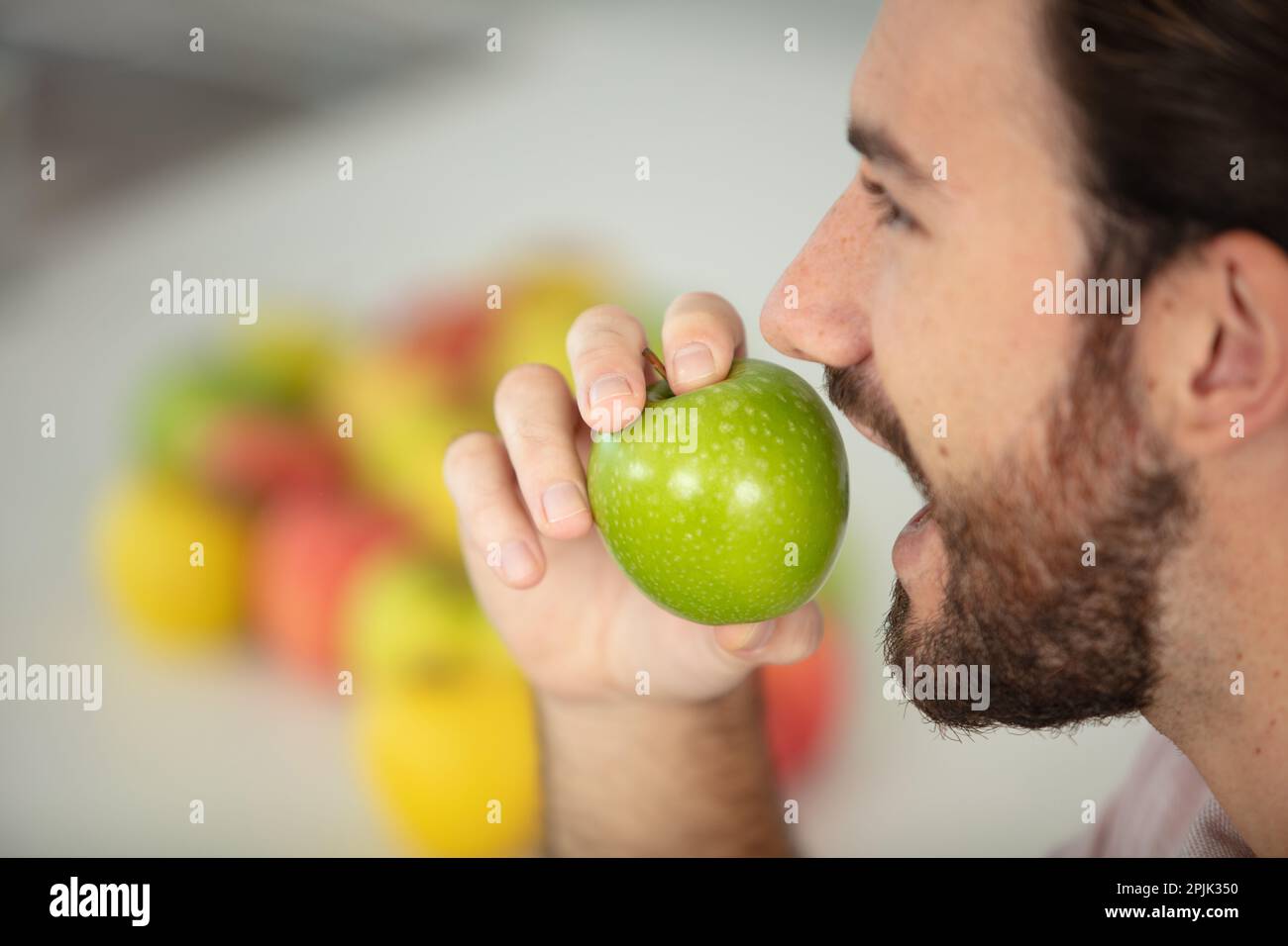Mouth biting apple hi-res stock photography and images - Alamy