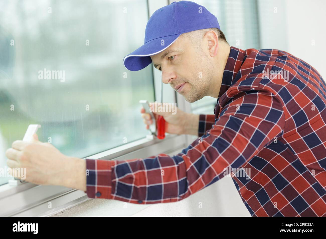 Fixing a window hi-res stock photography and images - Alamy
