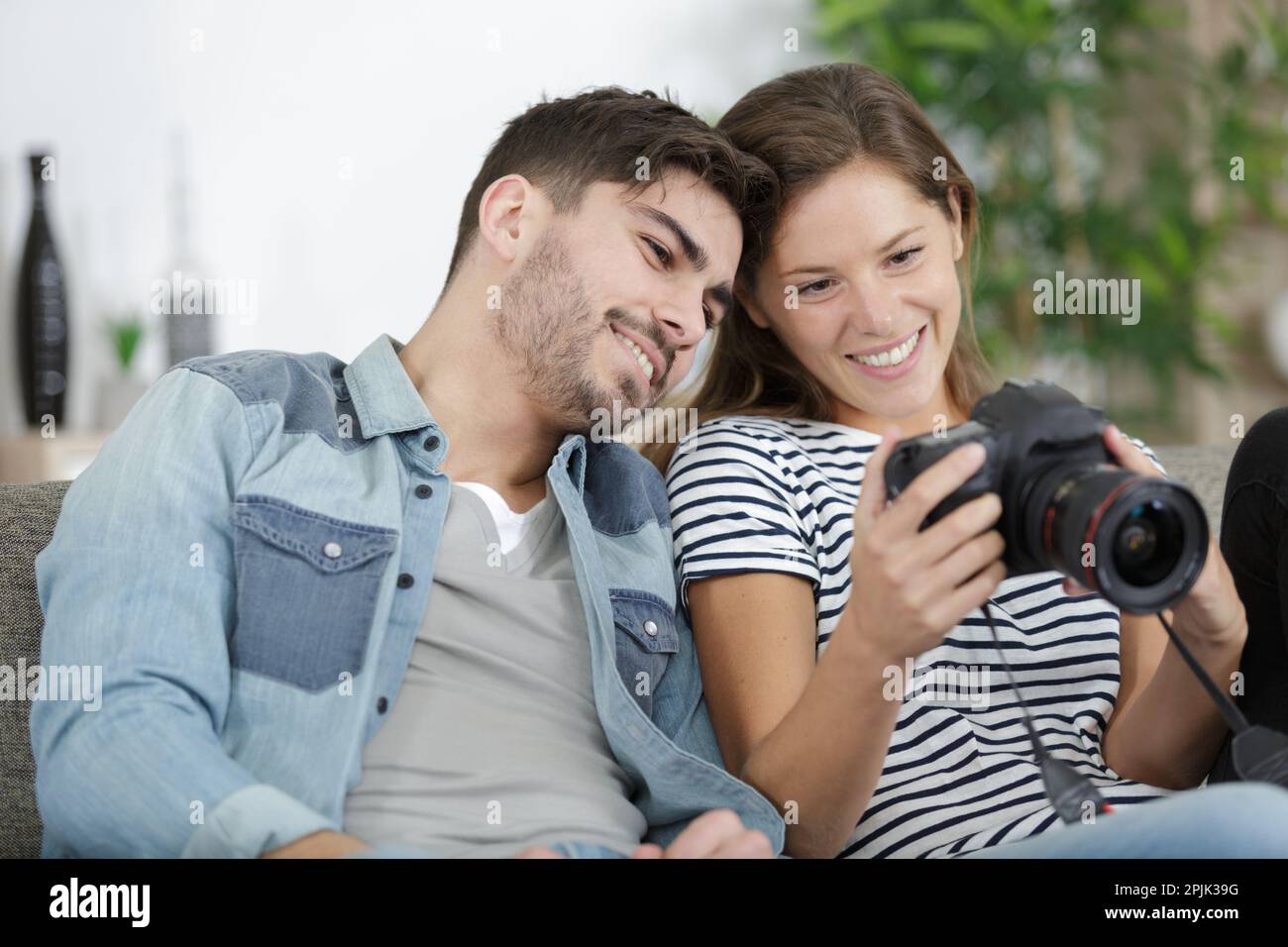 Looking at photos photographs on camera hi-res stock photography and ...