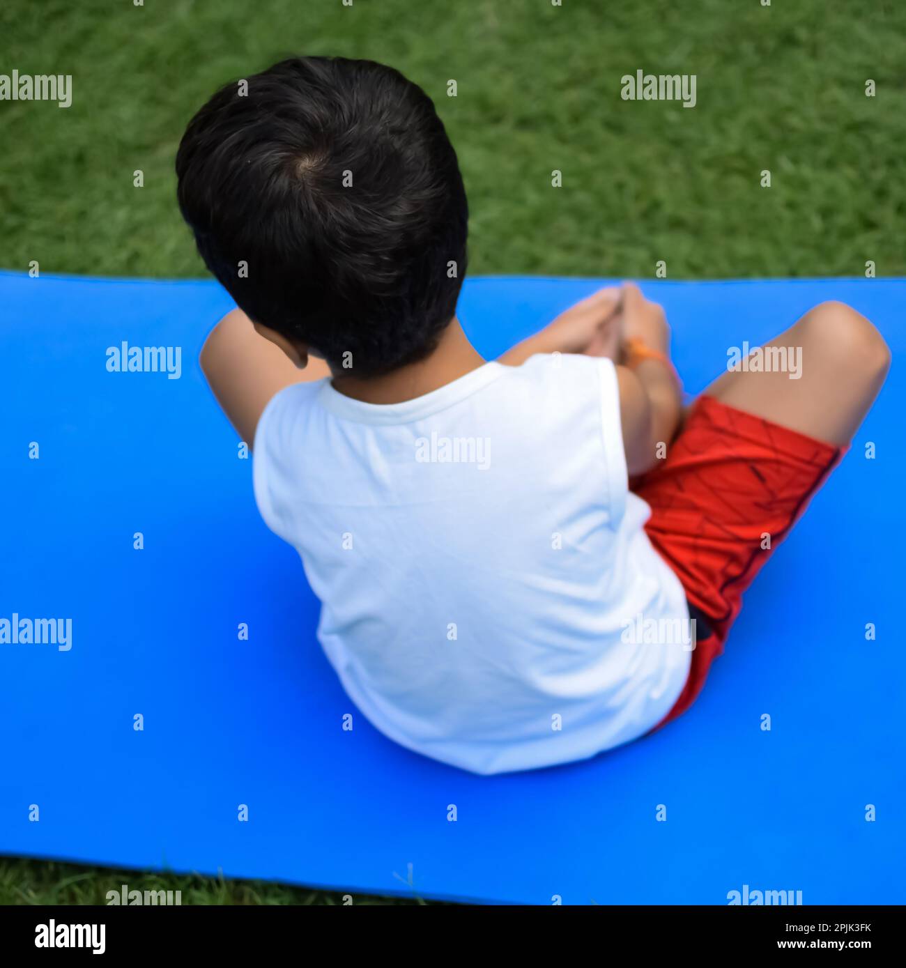 Asian smart kid doing yoga pose in the society park outdoor, Children's ...