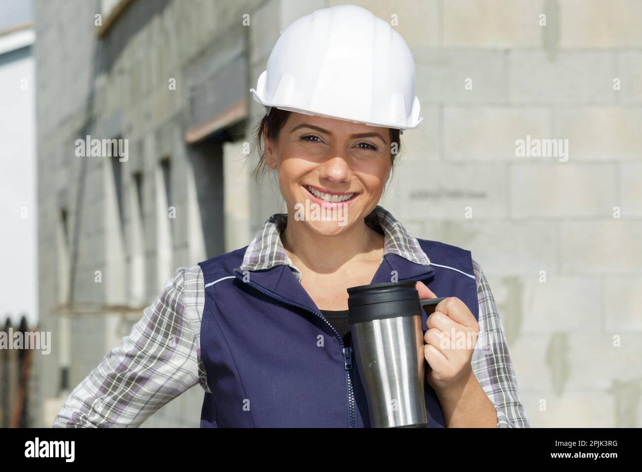 female construction worker having a coffee break Stock Photo - Alamy