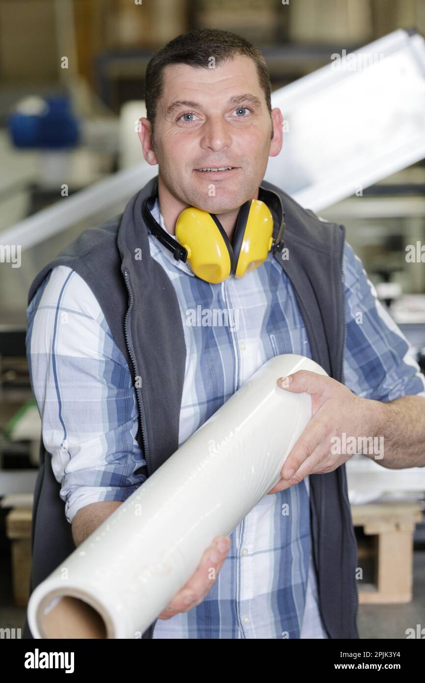 portrait of a factory man worker checking paperwork Stock Photo - Alamy