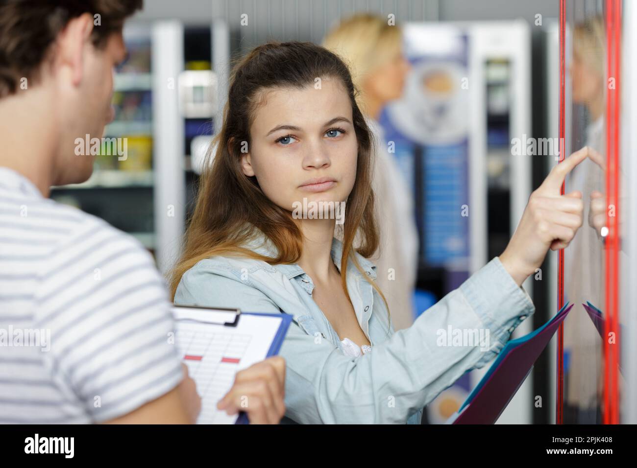 sad young woman in vending machine Stock Photo - Alamy