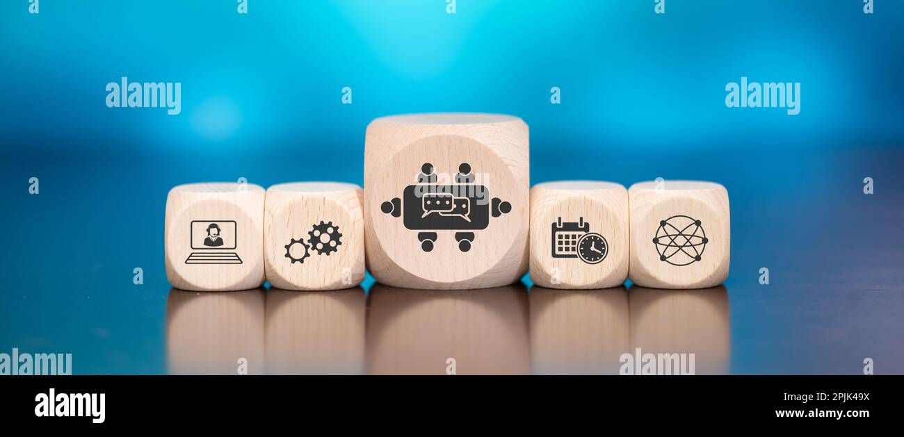 Wooden blocks with symbol of meeting concept on blue background Stock ...