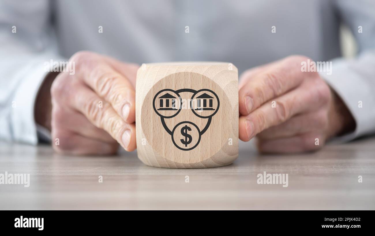 Wooden block with symbol of money transfer concept Stock Photo - Alamy