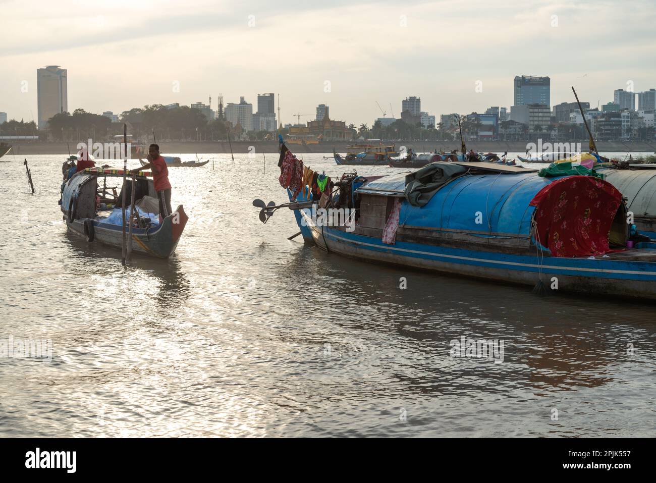 Phnom Penh,Cambodia-December 24th 2022:Small narrow boats,partially ...