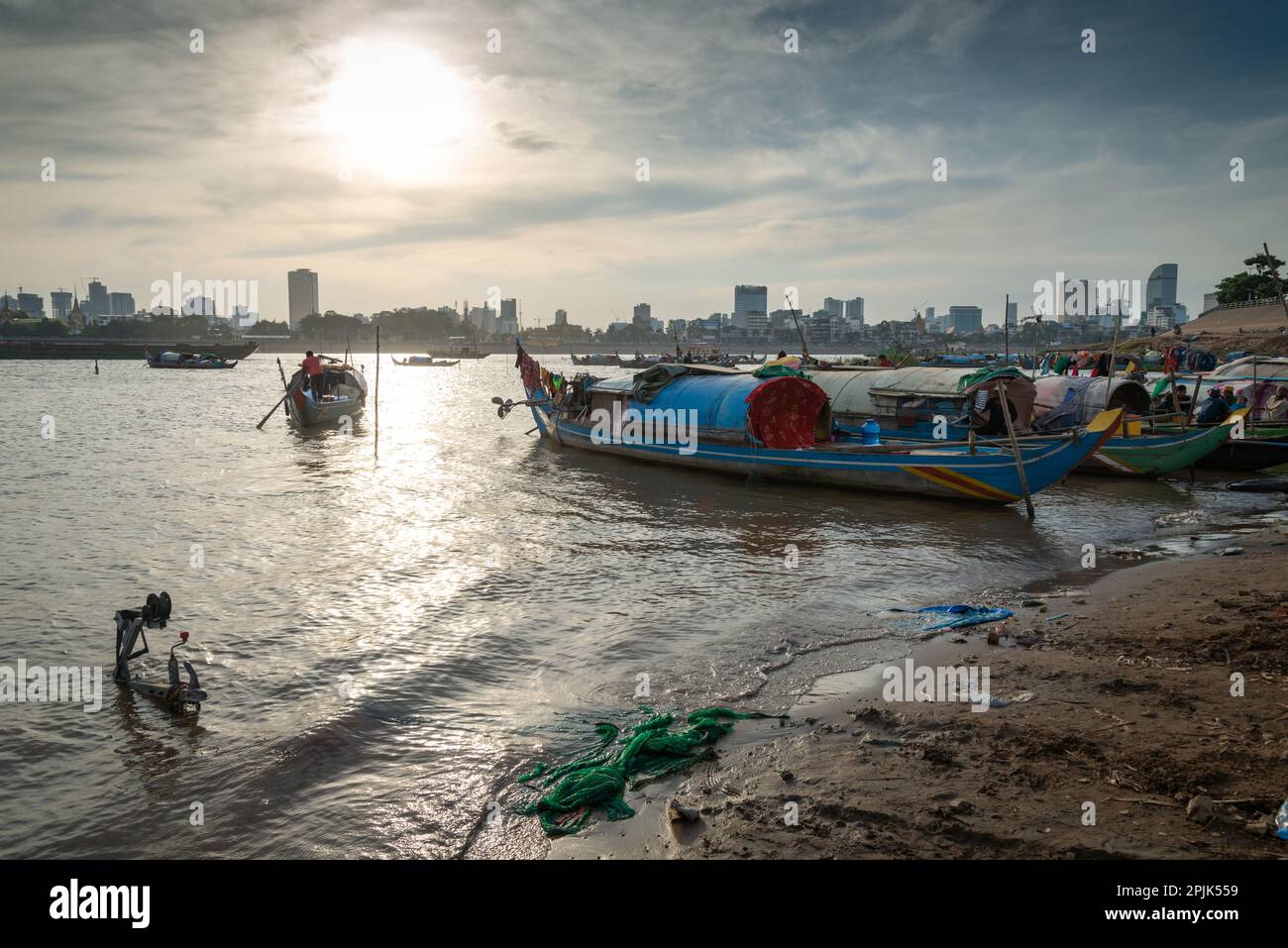 Phnom Penh,Cambodia-December 24th 2022:Small narrow boats,partially ...