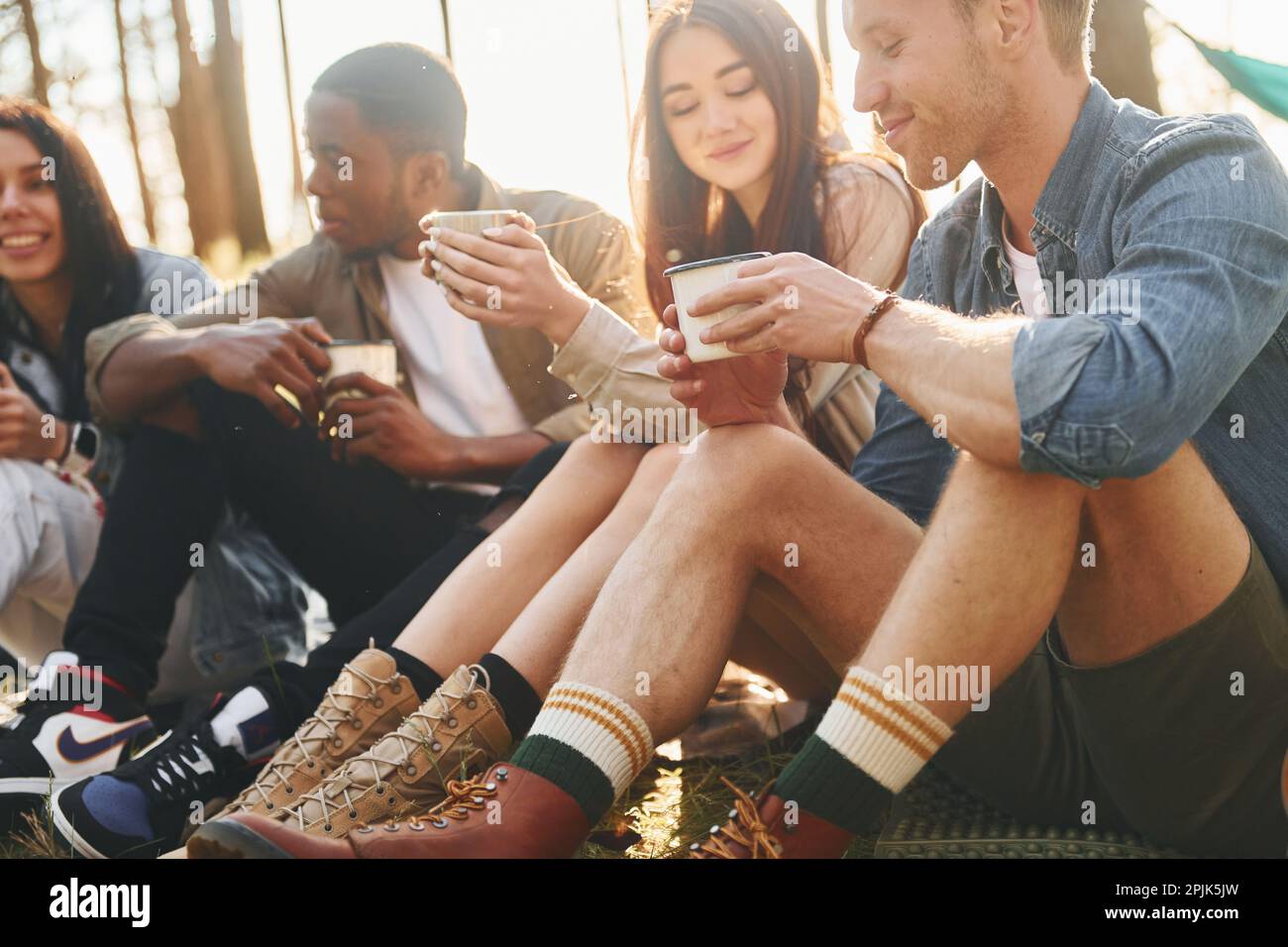 Talking with each other. Group of young people is traveling together in ...