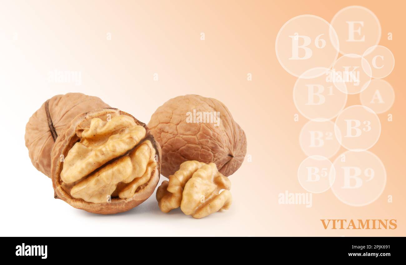 fresh kernels, broken and whole walnuts close-up isolated on color ...