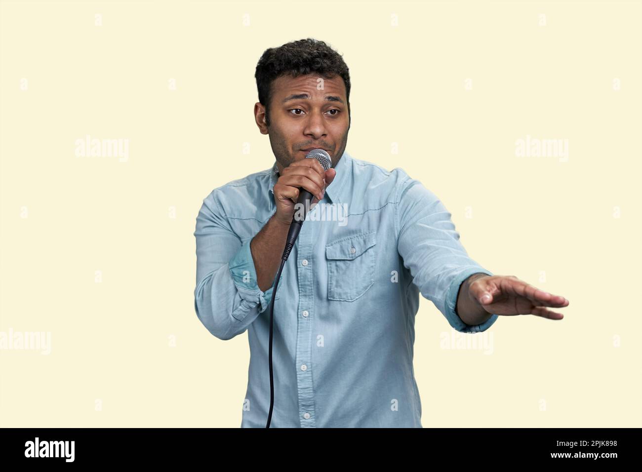 Portrait Of A Young Southeast Asian Man With Microphone Singer Or