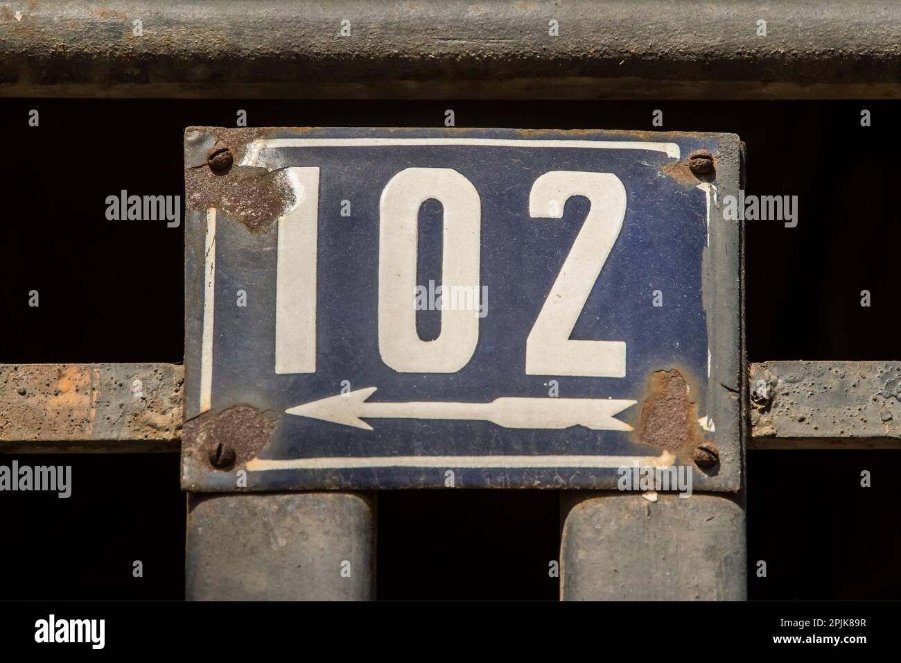 Weathered grunge square metal enameled plate of number of street ...
