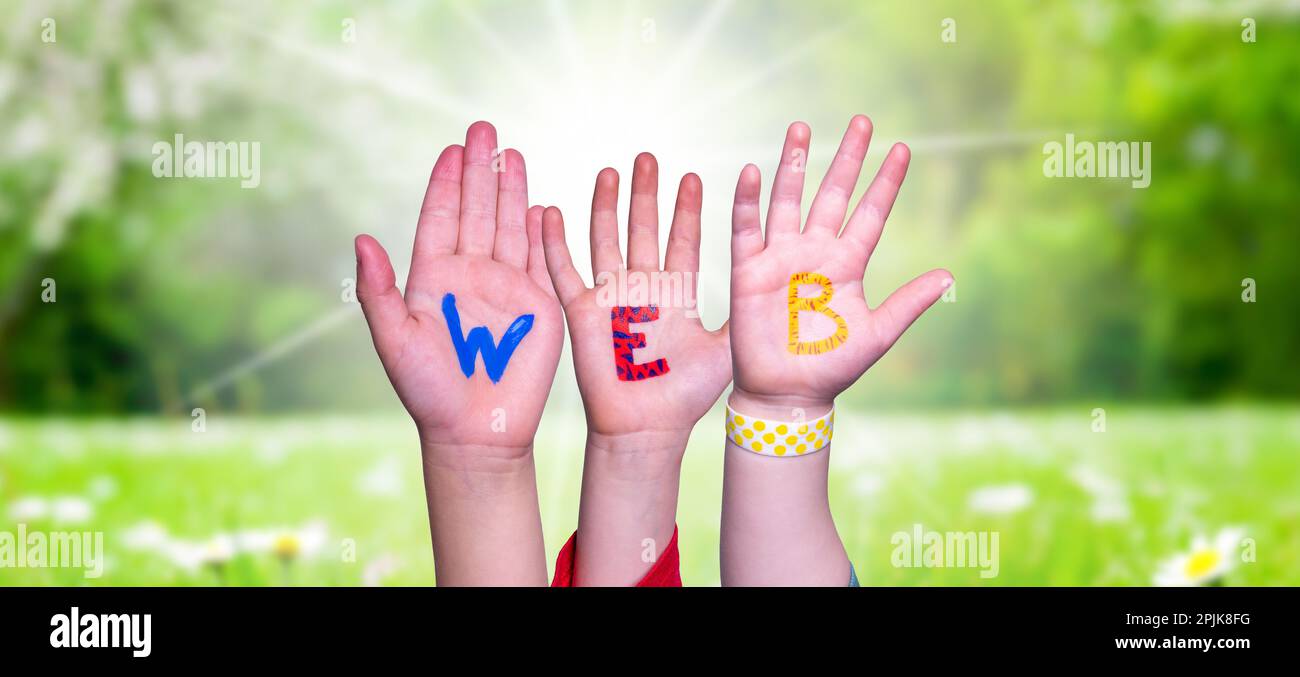 Children Hands Building Word Web, Grass Meadow Stock Photo - Alamy