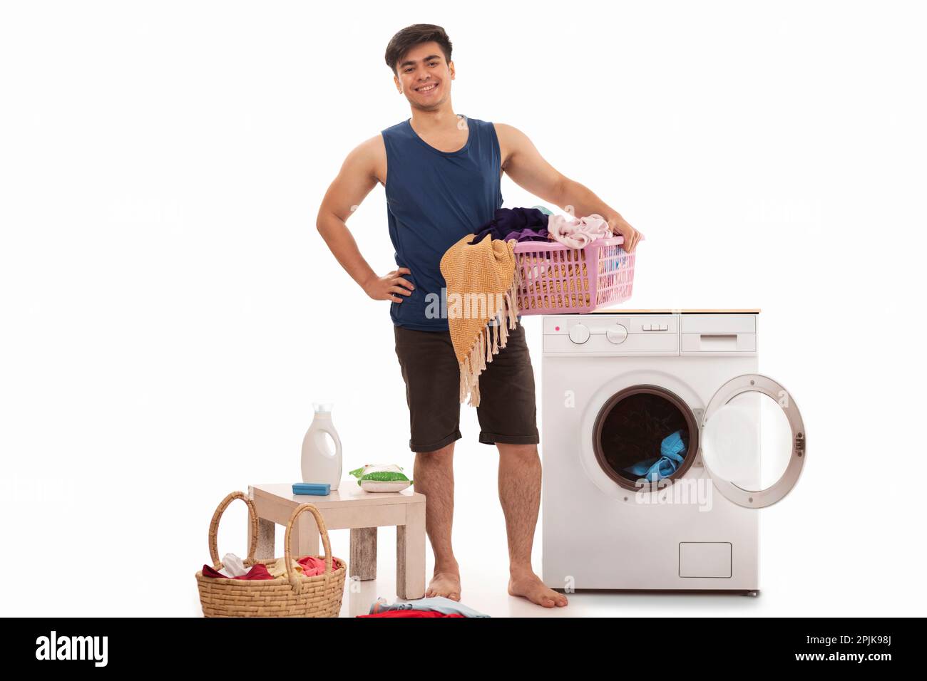 Young man laundry detergents hi-res stock photography and images - Alamy