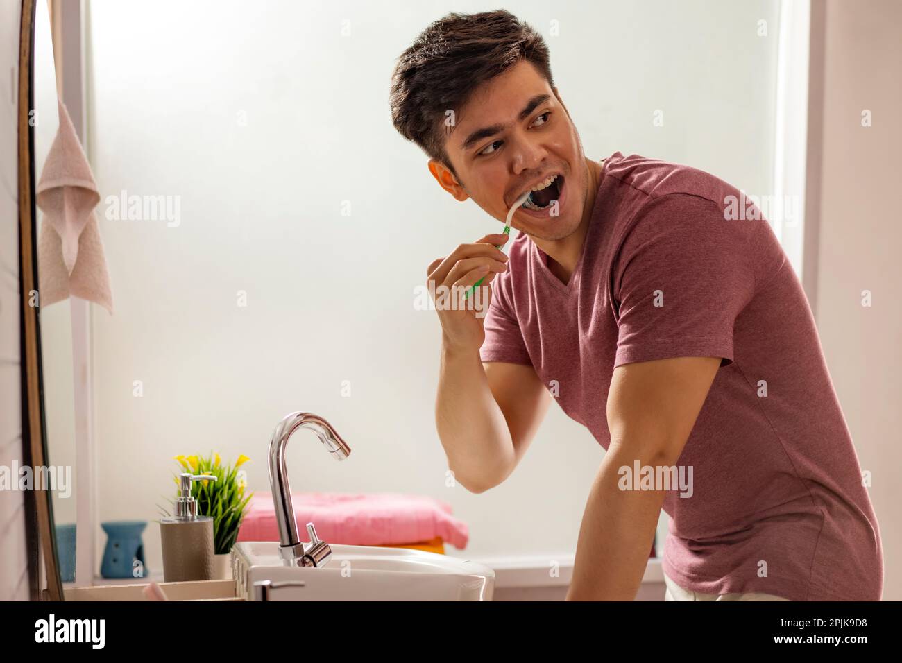 Man brushing teeth bathroom sink hi-res stock photography and images ...