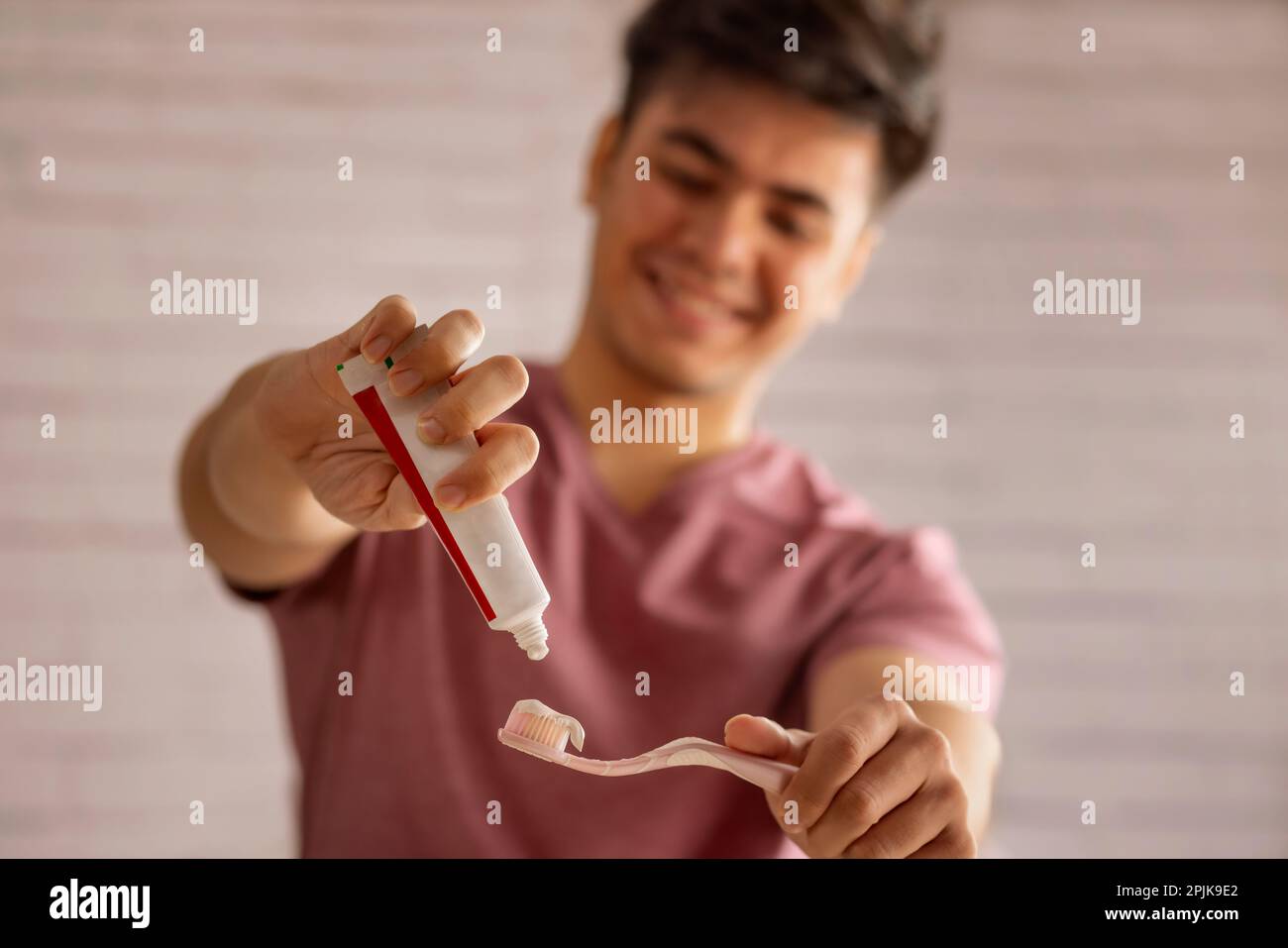 Man holding toothbrush toothpaste on hi-res stock photography and ...