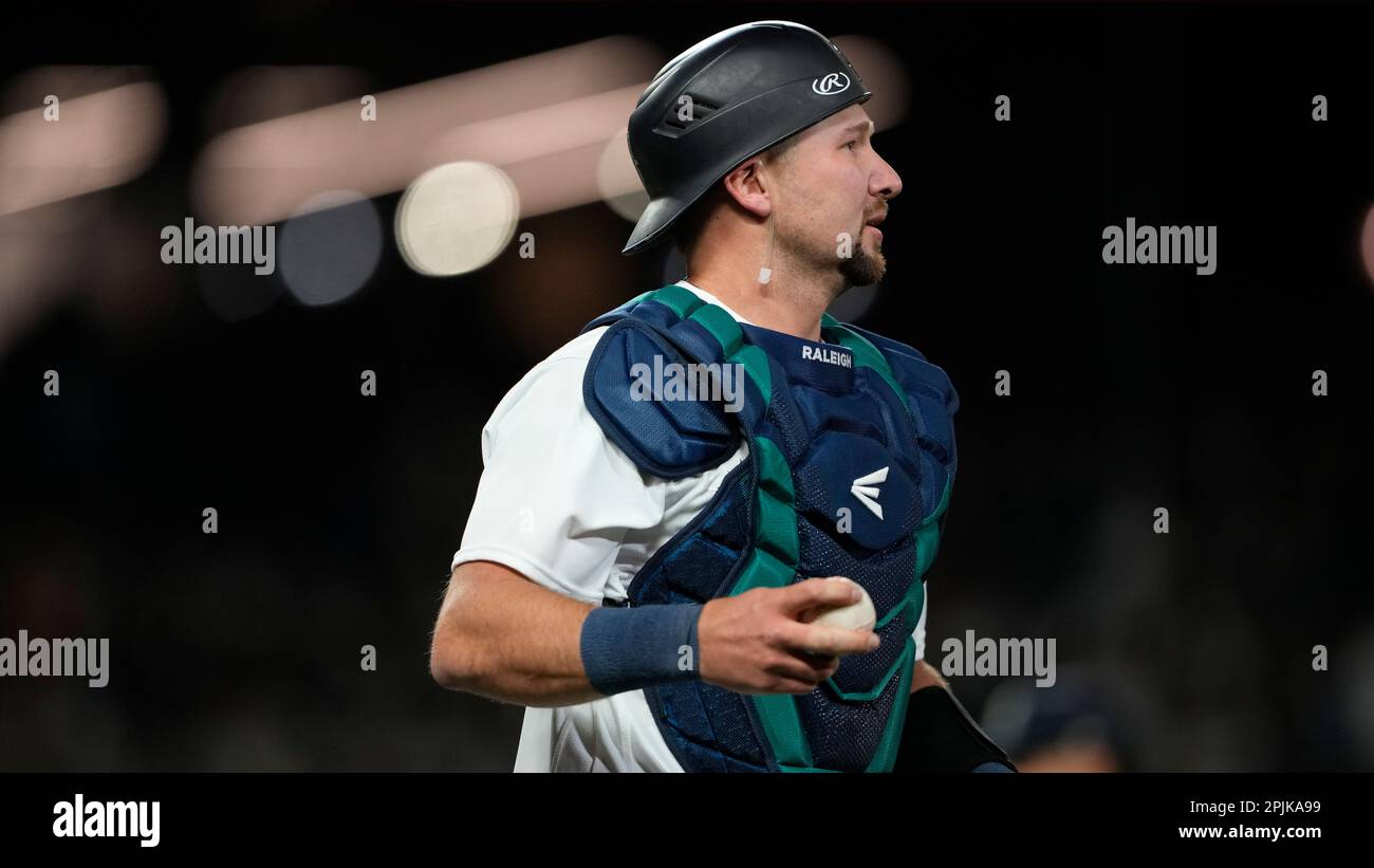 Seattle Mariners catcher Cal Raleigh holds the ball during a play ...