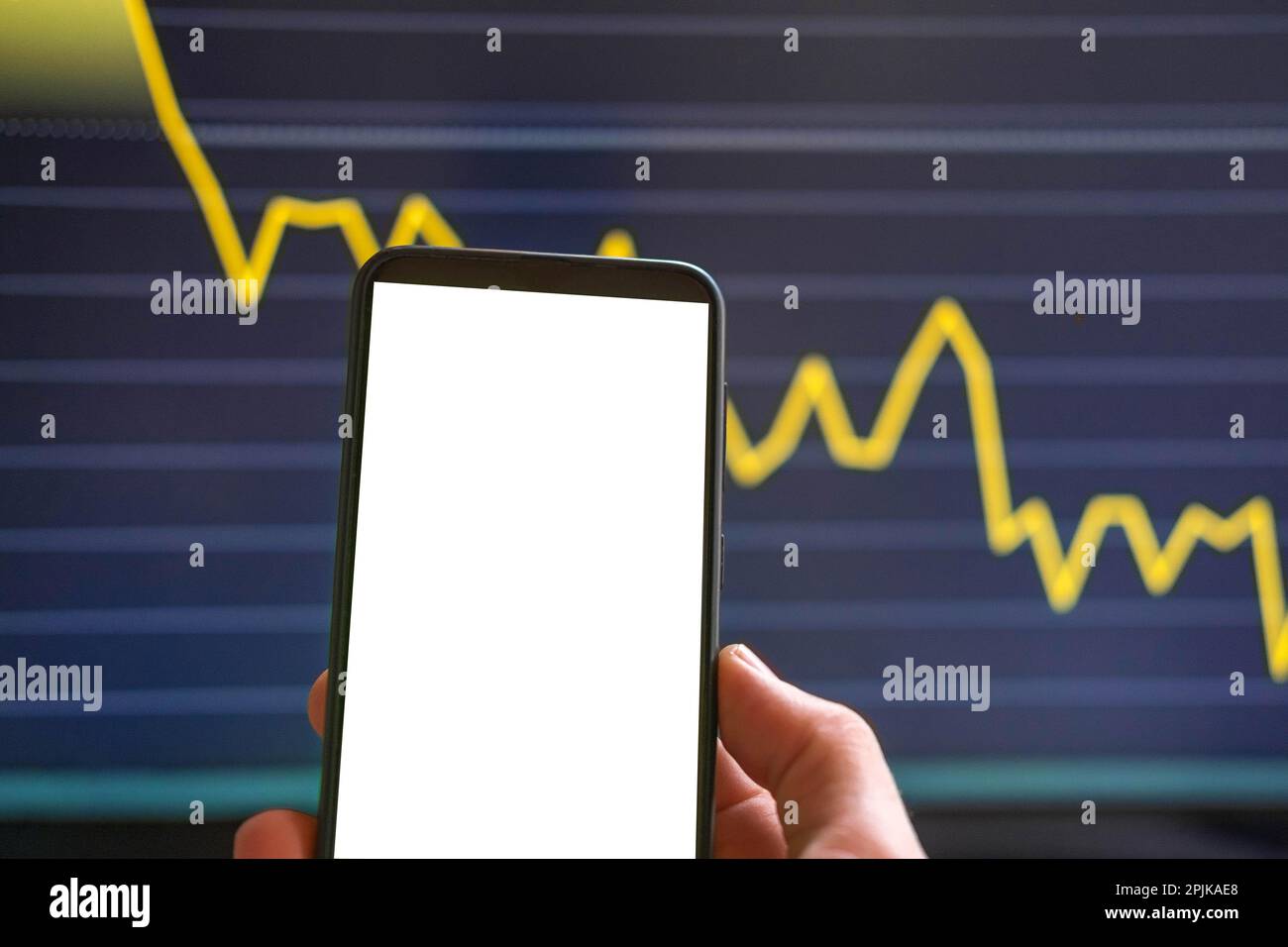 Black phone with blank mockup screen on rising stock graph. Closeup ...