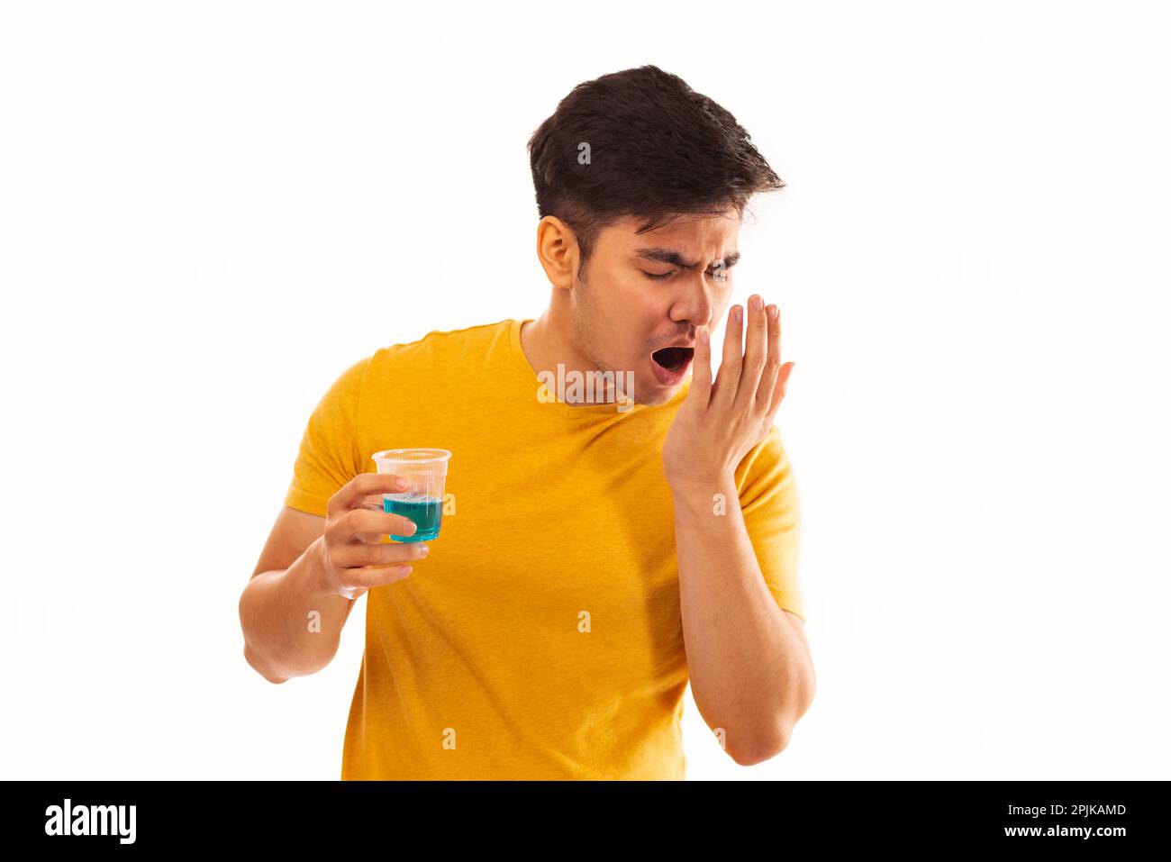 Young man smelling his breath after using mouthwash Stock Photo - Alamy Young man smelling his breath after using mouthwash Stock Photo - Alamy