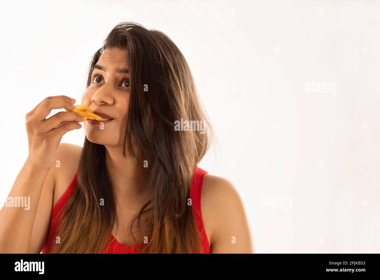 Standing eating french fries hi-res stock photography and images - Alamy
