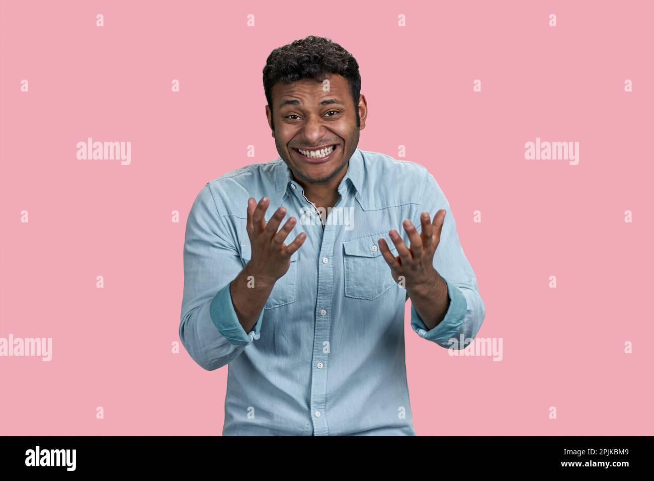 Young arab man laughing with teeth at something ridiculous. Isolated on ...