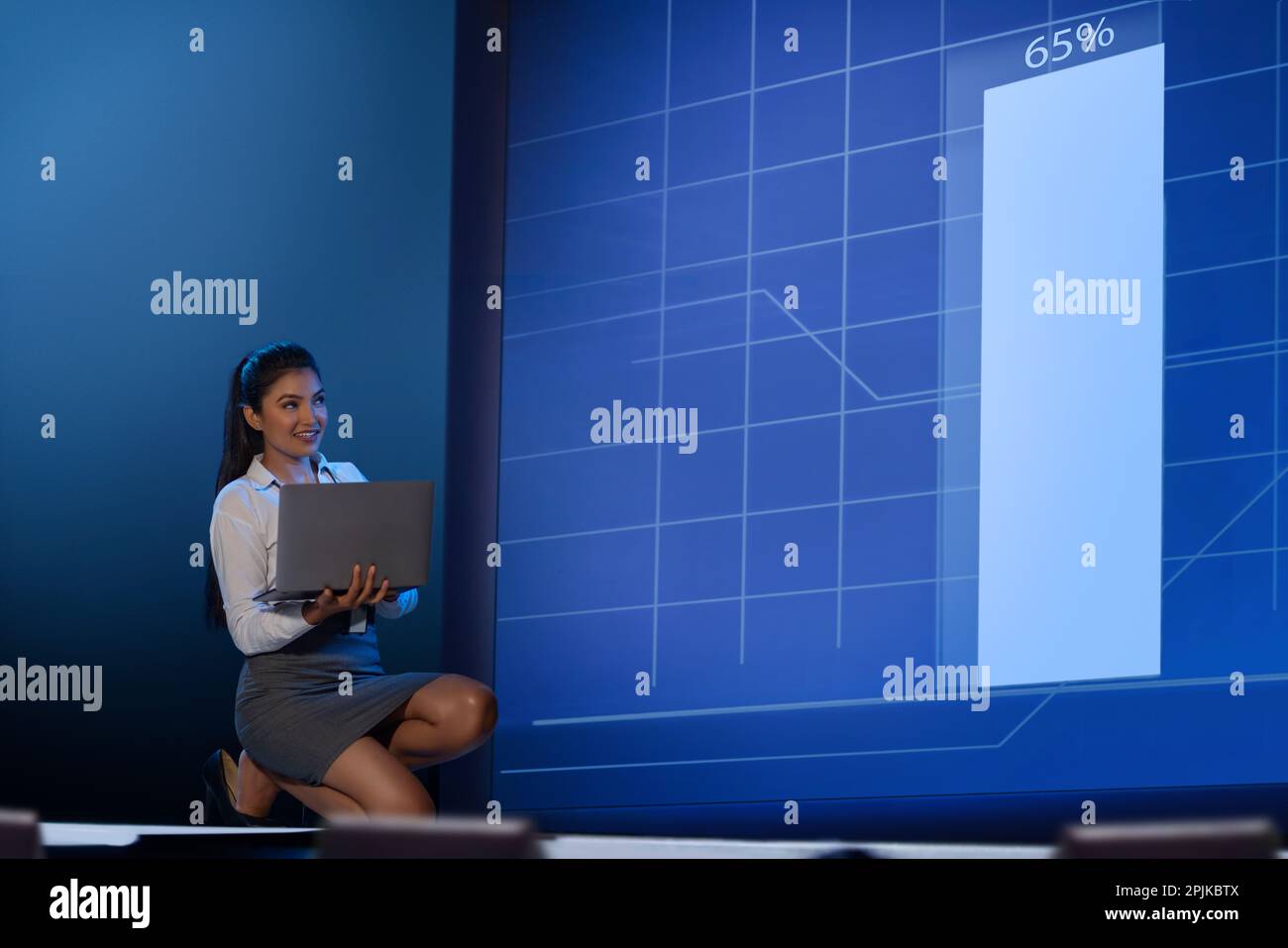 Technician/programmer holding a laptop in the server/data room Stock ...