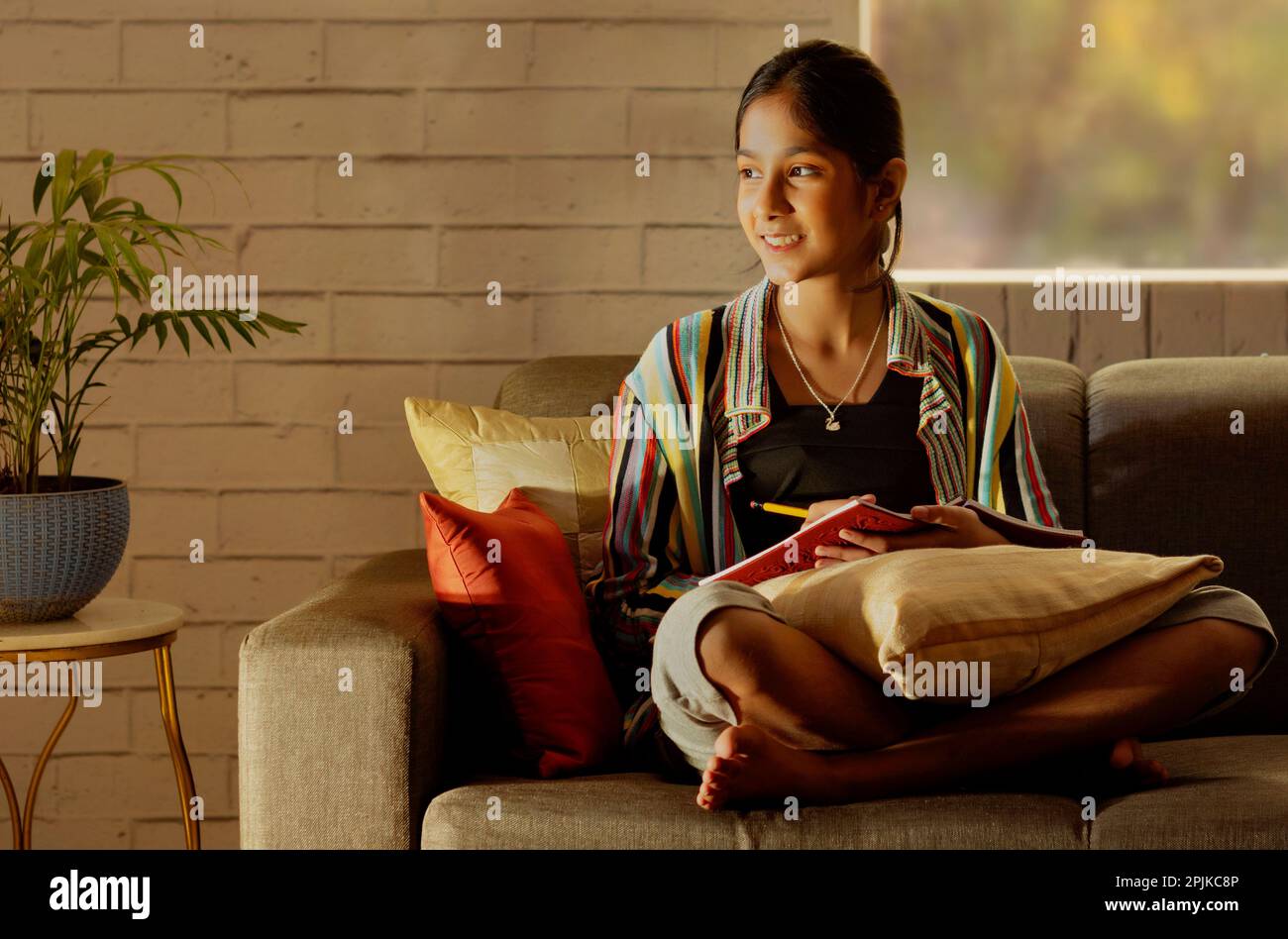 Cute girl studying in hi-res stock photography and images - Alamy