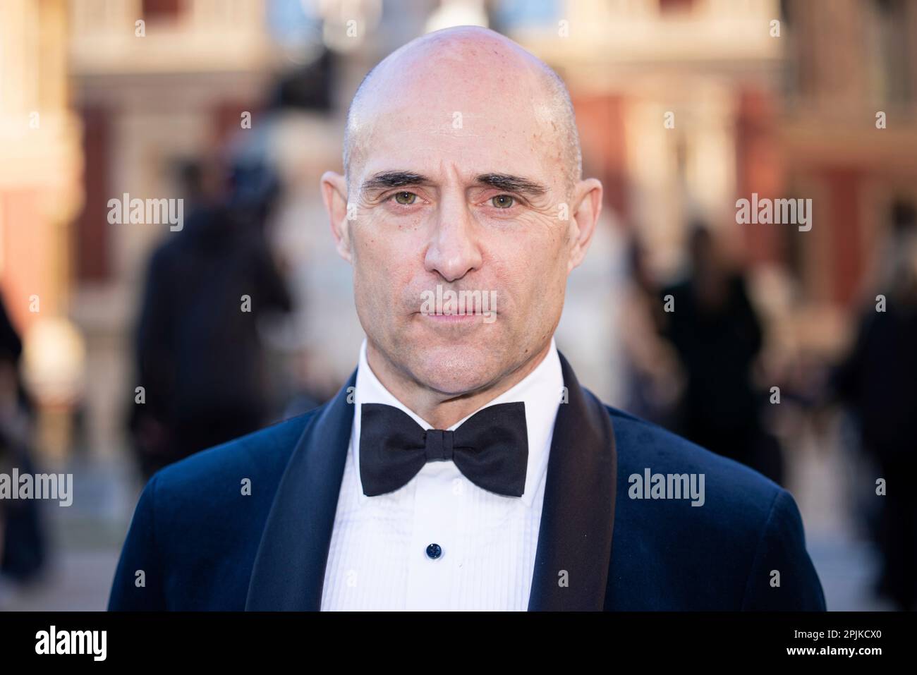 Mark Strong poses for photographers upon arrival at the Olivier Awards ...