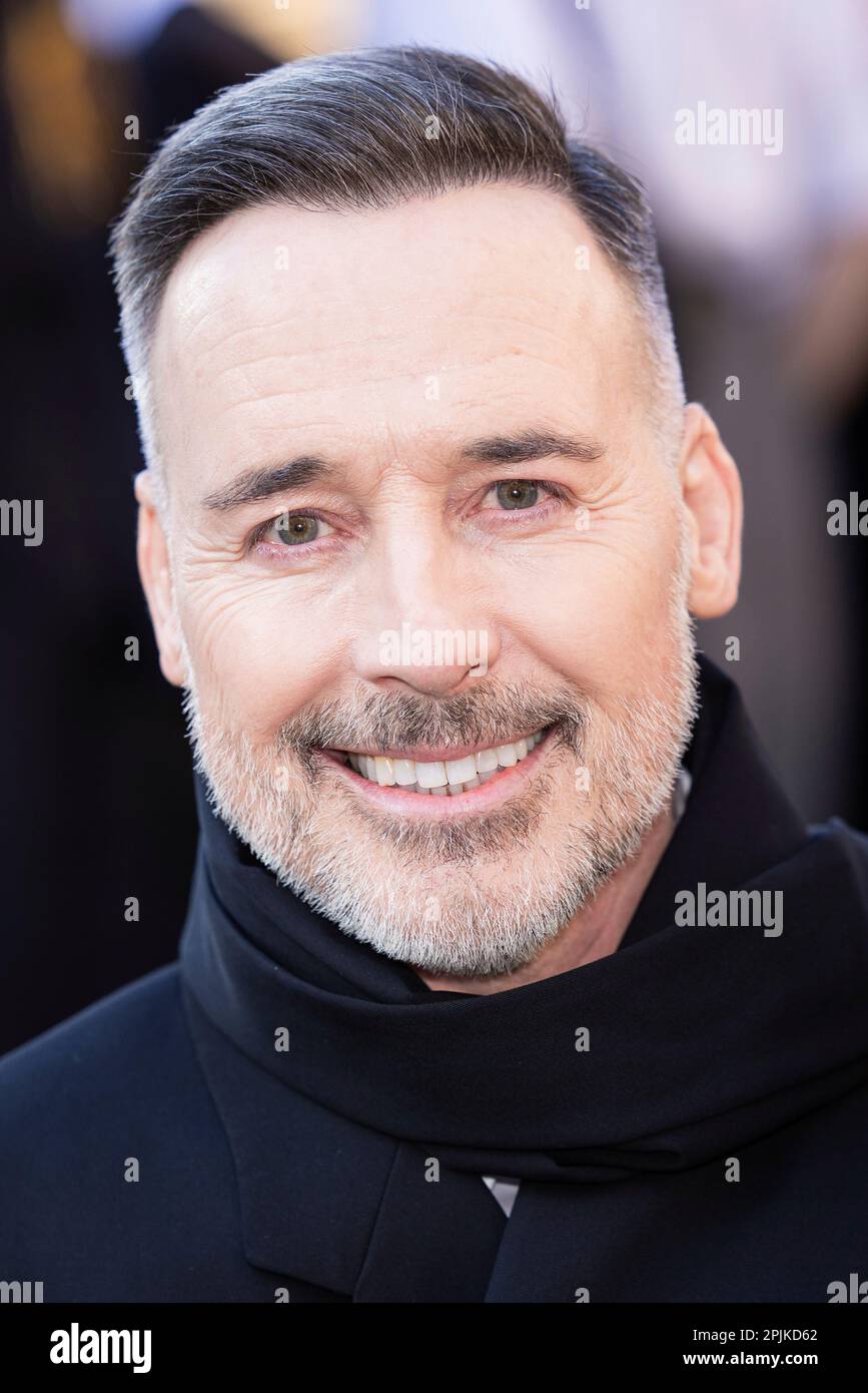 David Furnish poses for photographers upon arrival at the Olivier ...