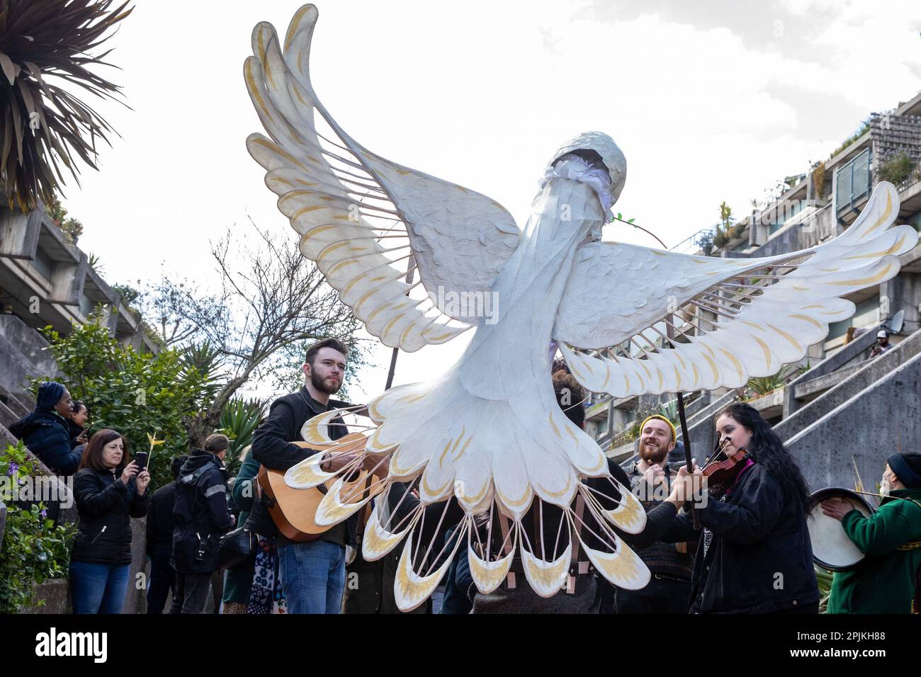 London, UK. 2nd April, 2023. A dove puppet and musicians lead Little ...