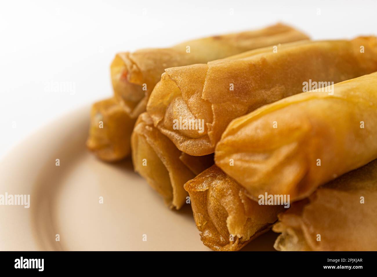 spring rolls on a white background Stock Photo - Alamy