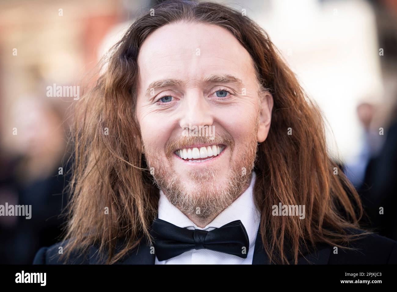 Tim Minchin poses for photographers upon arrival at the Olivier Awards in London, Sunday, April ...