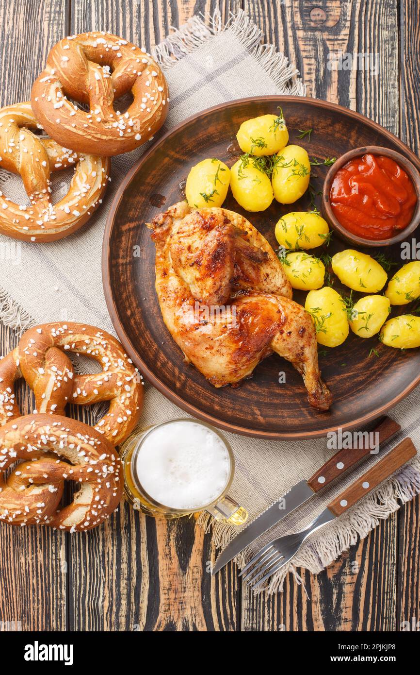 Oktoberfest Roast Chicken Wiesn Hendl with potatoes served with beer ...