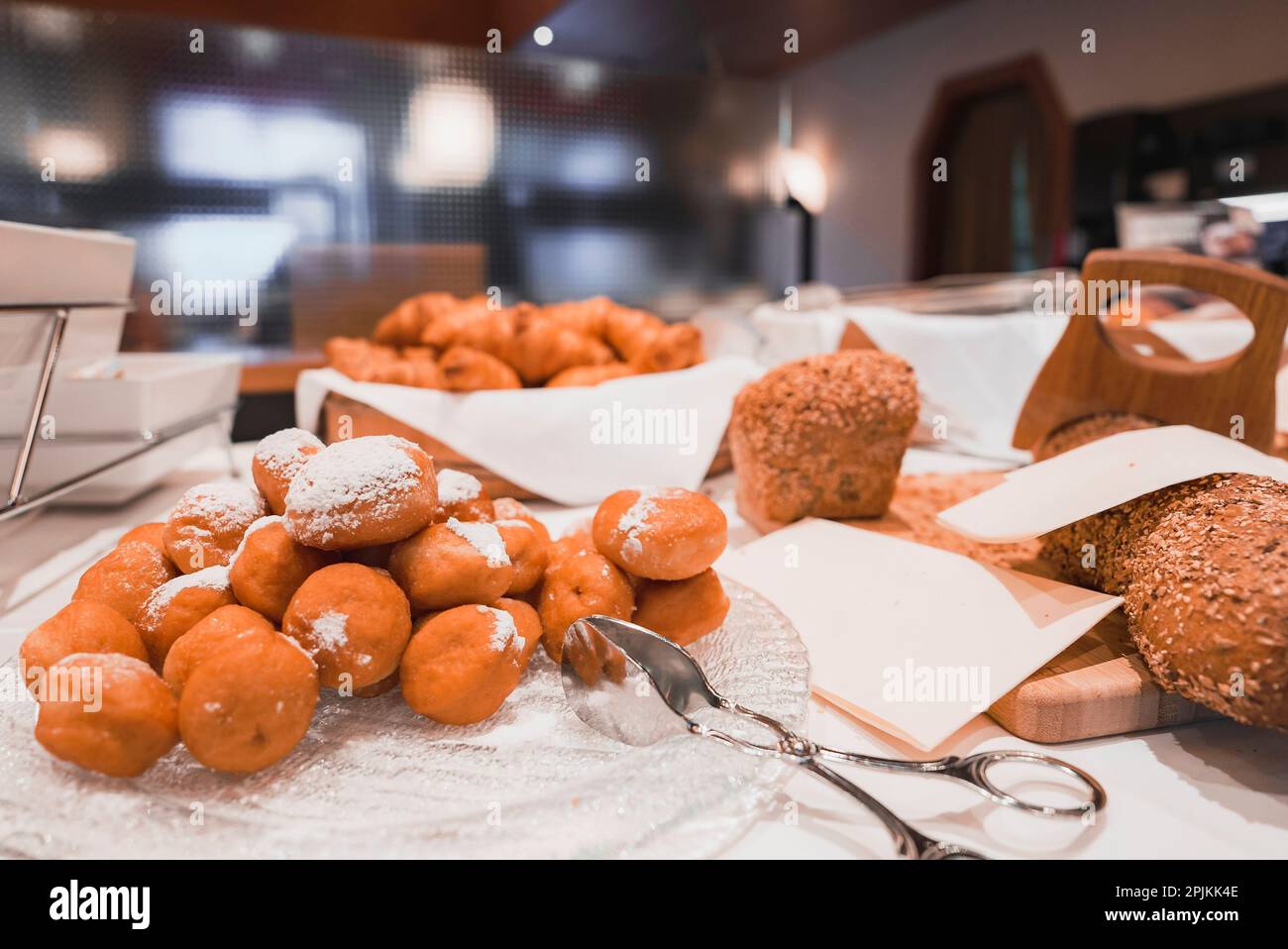 Delicious panoramic view of the buffet table with waffle and donut in a ...