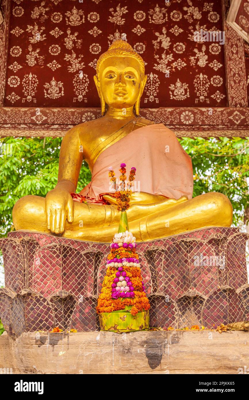 Laos, Luang Prabang. Golden Buddha statue and altar Stock Photo - Alamy