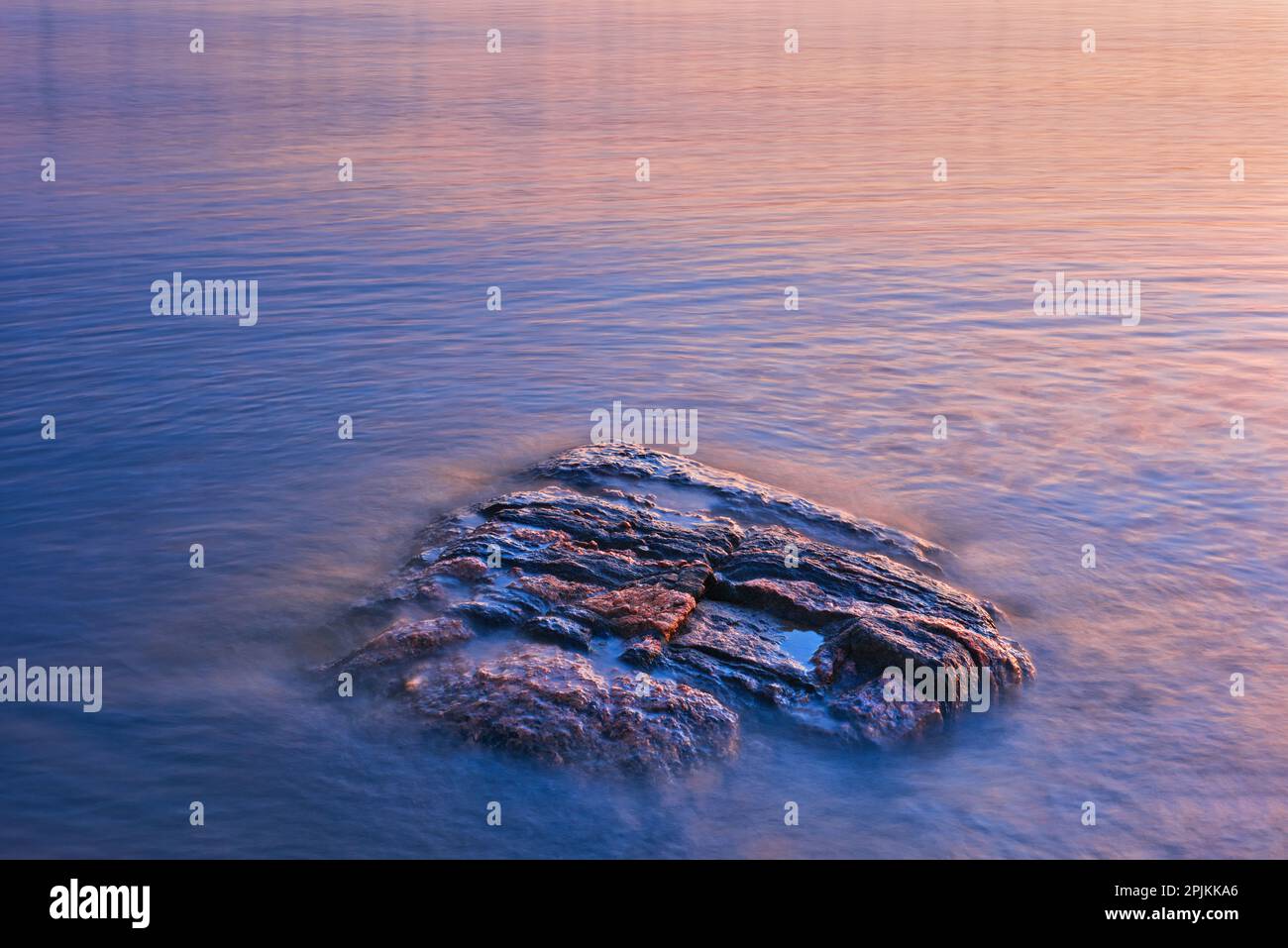 Canada, Manitoba, Paint Lake Provincial Park. Paint Lake. Exposed rock ...