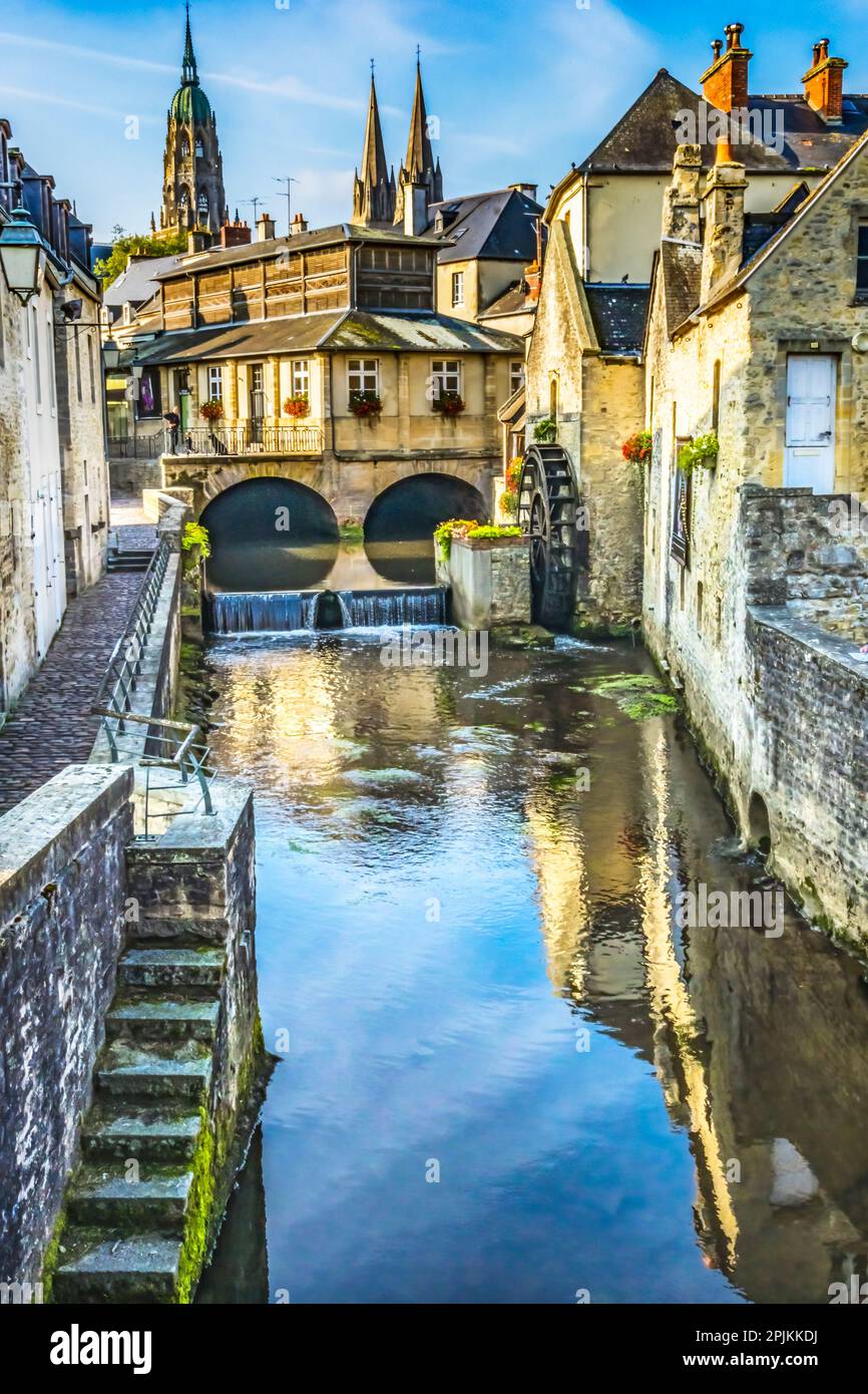 Colorful old buildings, Aure River reflection, Bayeux, Normandy, France ...