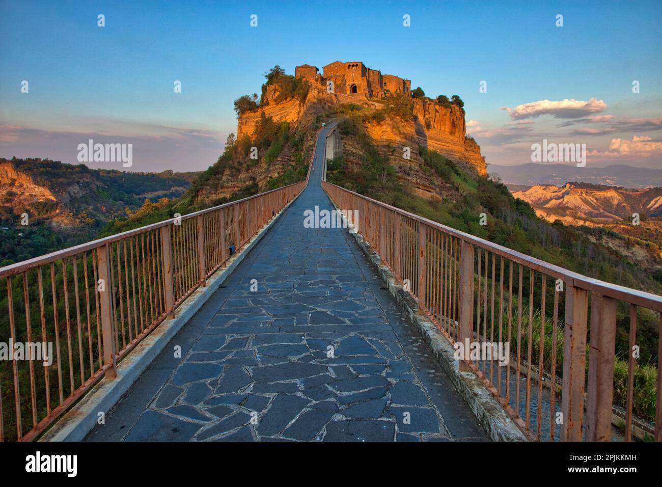 Italy, Tuscany. Evening light of Civita di Bagnoregio and the long ...
