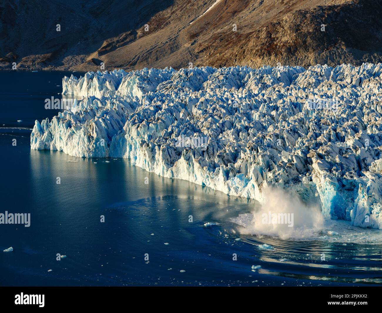 Ice calving. Knud Rasmussen Glacier (also called Apuseeq Glacier) in Sermiligaaq Fjord ...