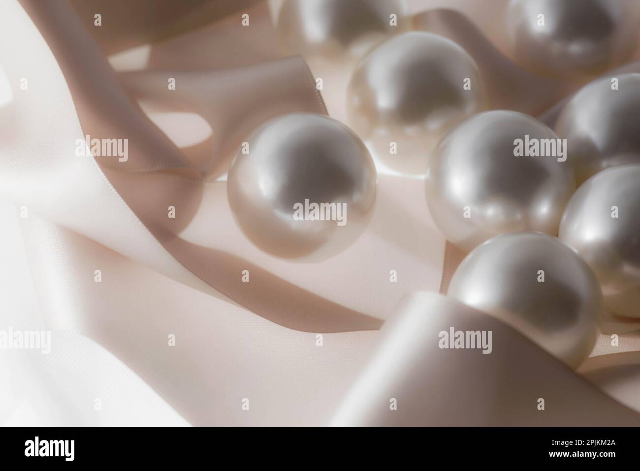 Pearls and ribbons Stock Photo - Alamy