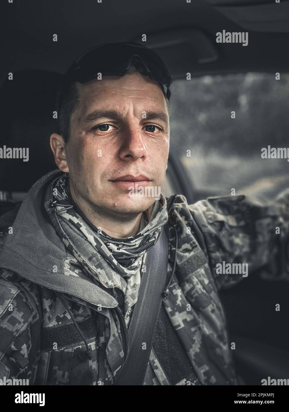 Portrait of a tired soldier of the Ukrainian army in camouflage. A 37 ...