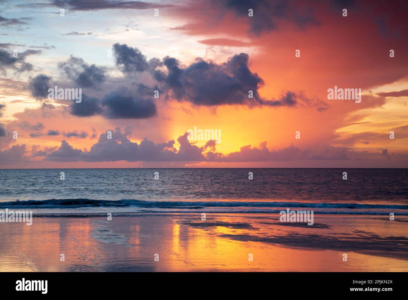 USA, Georgia, Tybee Island. Sunrise with reflections and clouds Stock ...