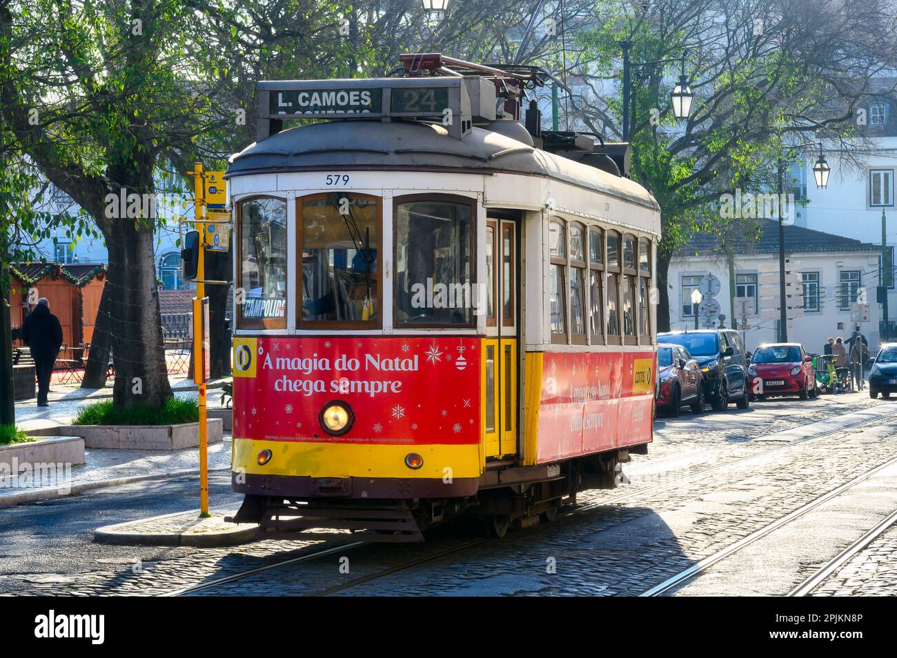 Lisbon, Portugal - January 4, 2023: Red streetcar moving through an old ...
