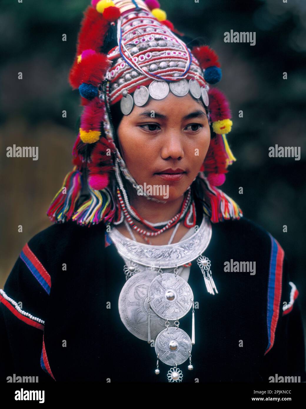 Thailand. Young woman of the Akha tribe in traditional garb Stock Photo ...