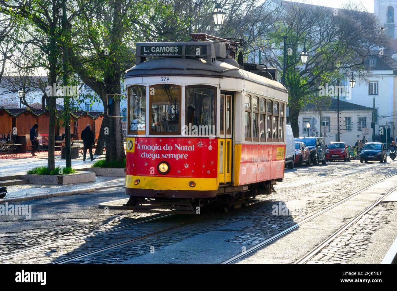 Lisbon, Portugal - January 4, 2023: Red streetcar moving through an old ...