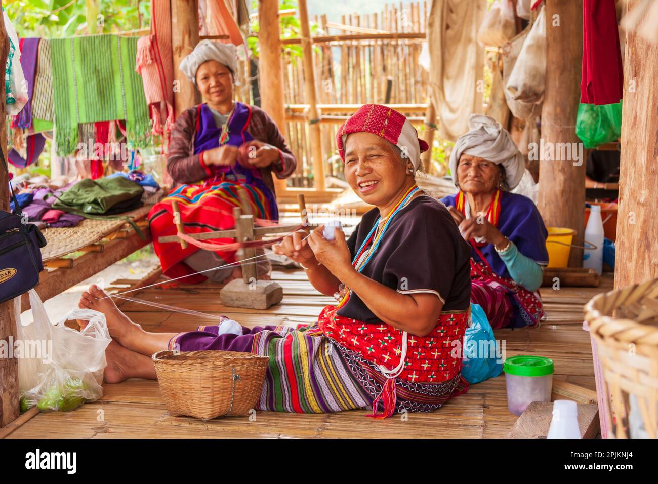 Chiang Mai, Thailand. Karen villager weaving traditional textiles ...