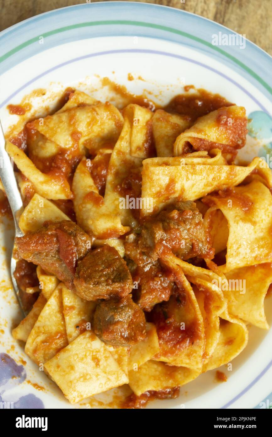 Handmade egg pappardelle with red wild boar ragout Stock Photo - Alamy