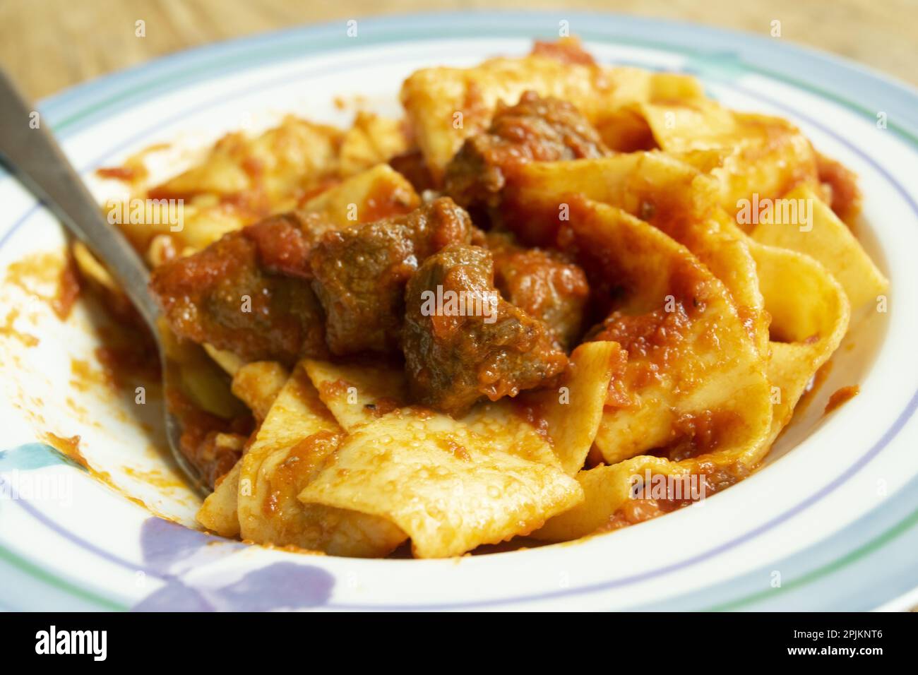 Handmade egg pappardelle with red wild boar ragout Stock Photo - Alamy