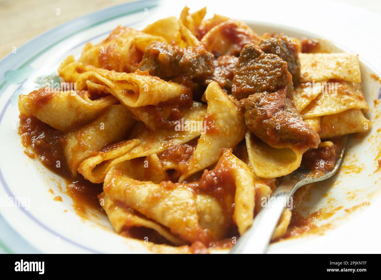 Handmade egg pappardelle with red wild boar ragout Stock Photo - Alamy