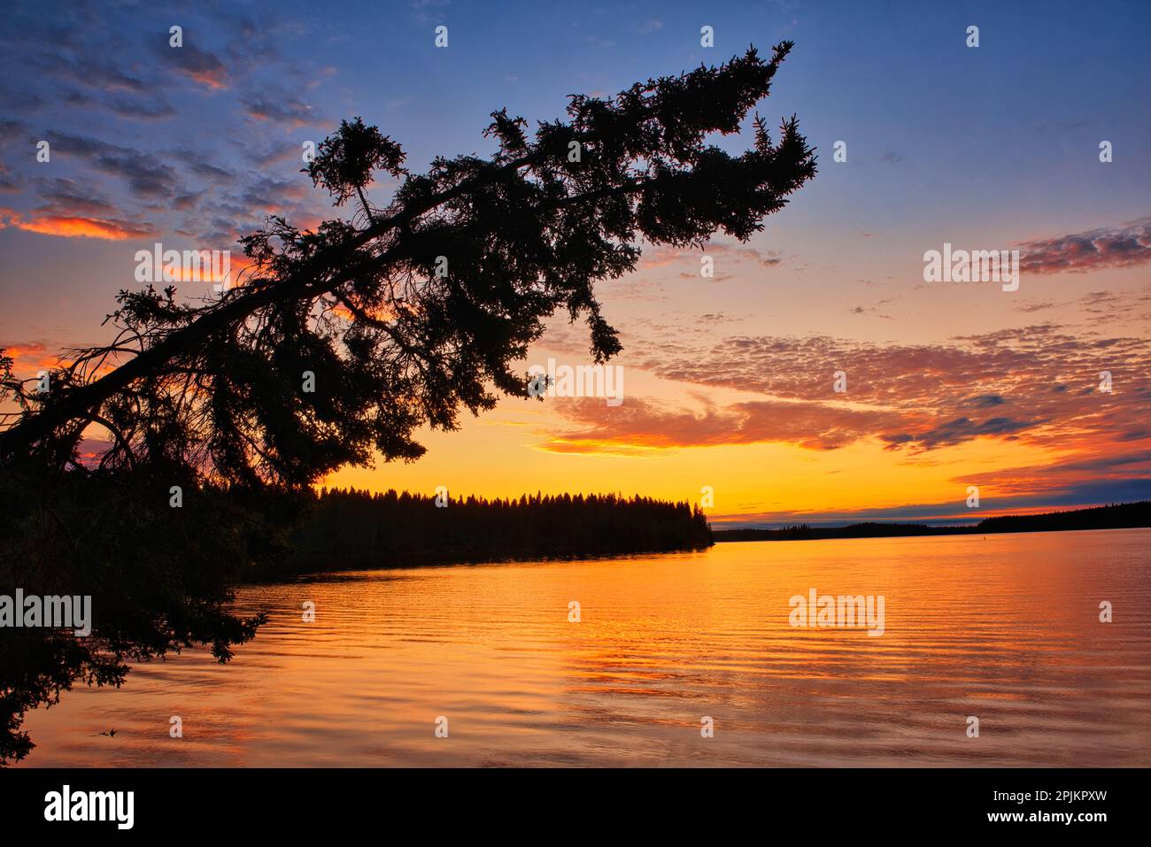 Canada, Manitoba, Paint Lake Provincial Park. Sunset on Paint Lake ...