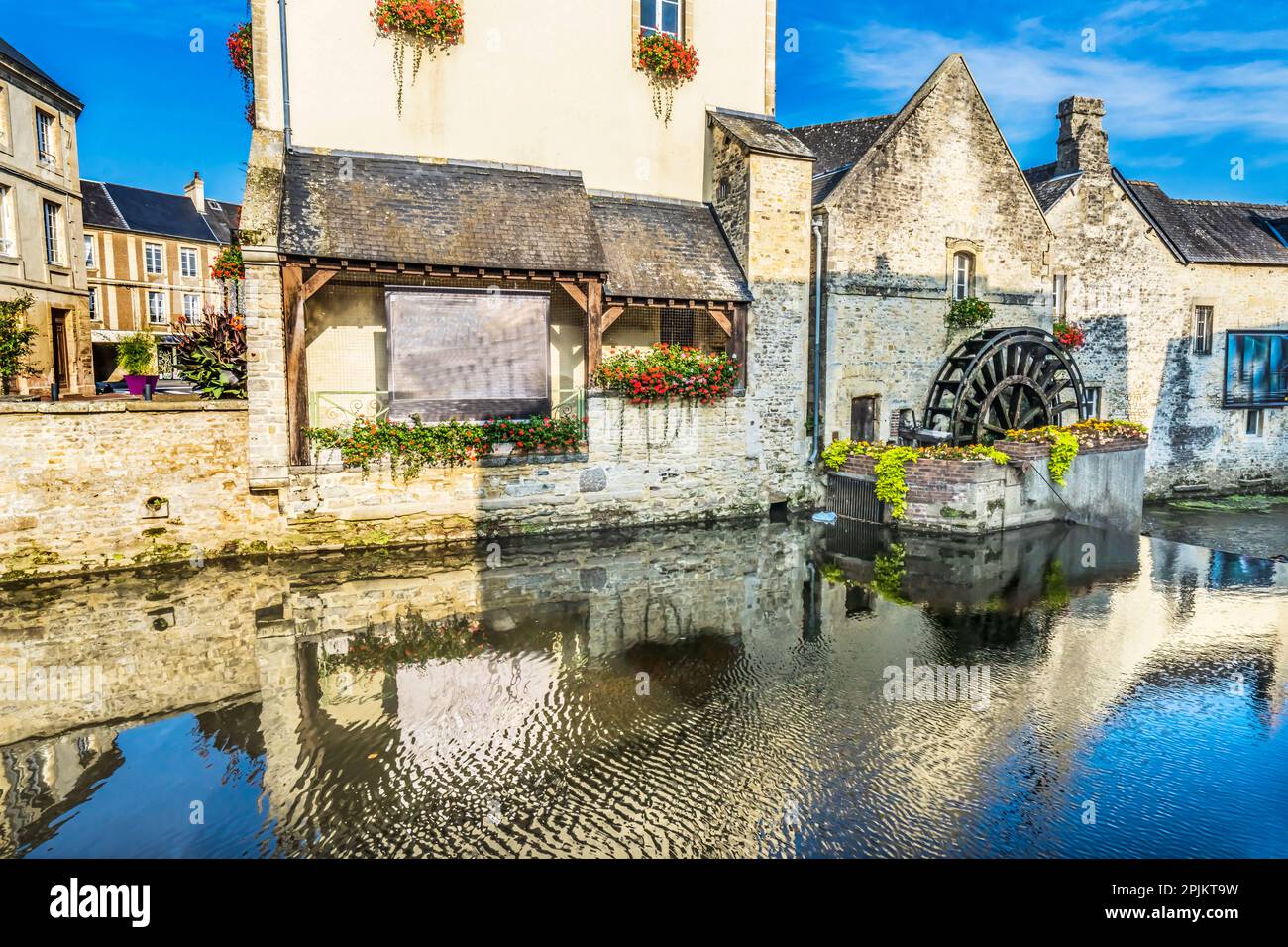 Colorful old buildings, Aure River reflection, Bayeux, Normandy, France ...